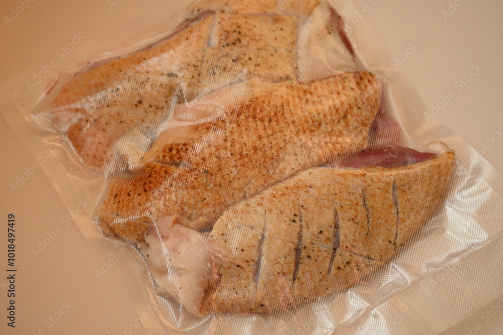 vacuum-sealed fresh duck breast in a bag, top photo of duck breast skin ...