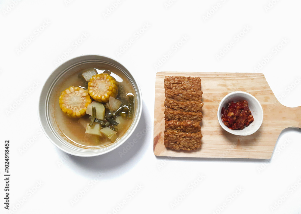 Sayur asam or sayur asem is popular soup in Indonesia. Served in a bowl ...
