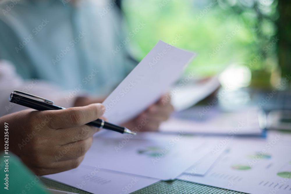 Analyzing green building performance metrics during business meeting ... Analyzing green building performance metrics during business meeting ...