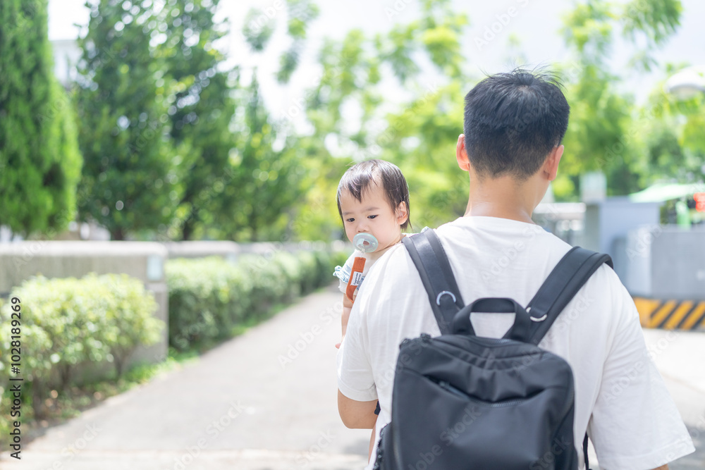 A 1 year old Taiwanese girl going out with her father, a man in his 20s ...