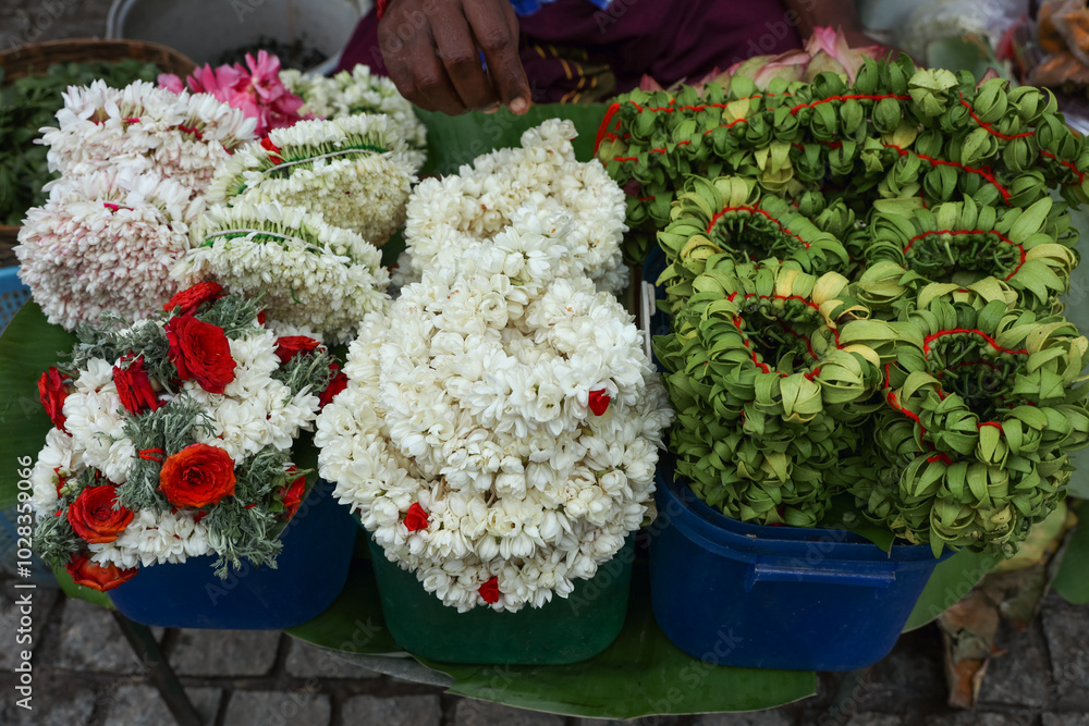 Indian lotus and marigold flowers wit coconut selling at street near ...