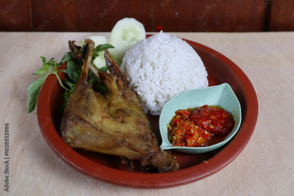 Penyet ayam or fried chicken in Indonesia is the name of a typical ...