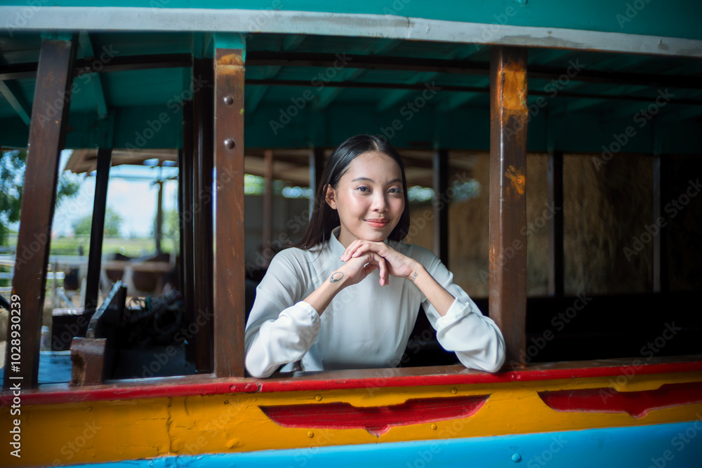 Vietnamese woman on a bus in rural Vietnam. Ao dai is famous ...