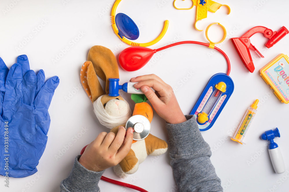 Toy Doctor's Check-Up with Stuffed Animal and Medical Kit on White ...