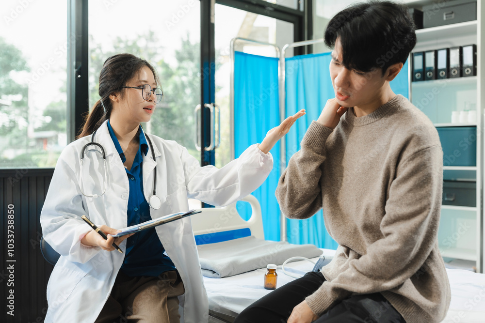 Doctor consulting patient filling form at consultation, talking to ...