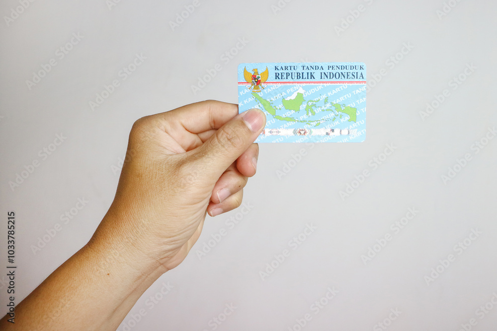 hand holding Indonesian identity cards or E-KTP ( Kartu Tanda Penduduk ...