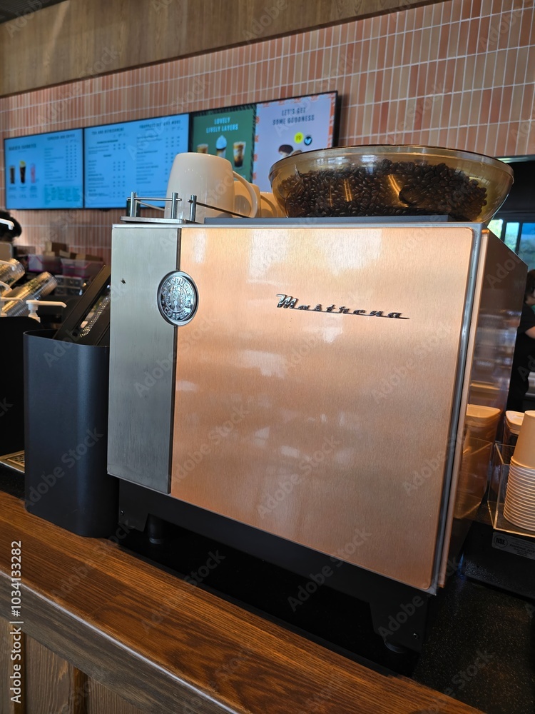 Modern espresso machine on a wooden counter in a coffee shop, with ...