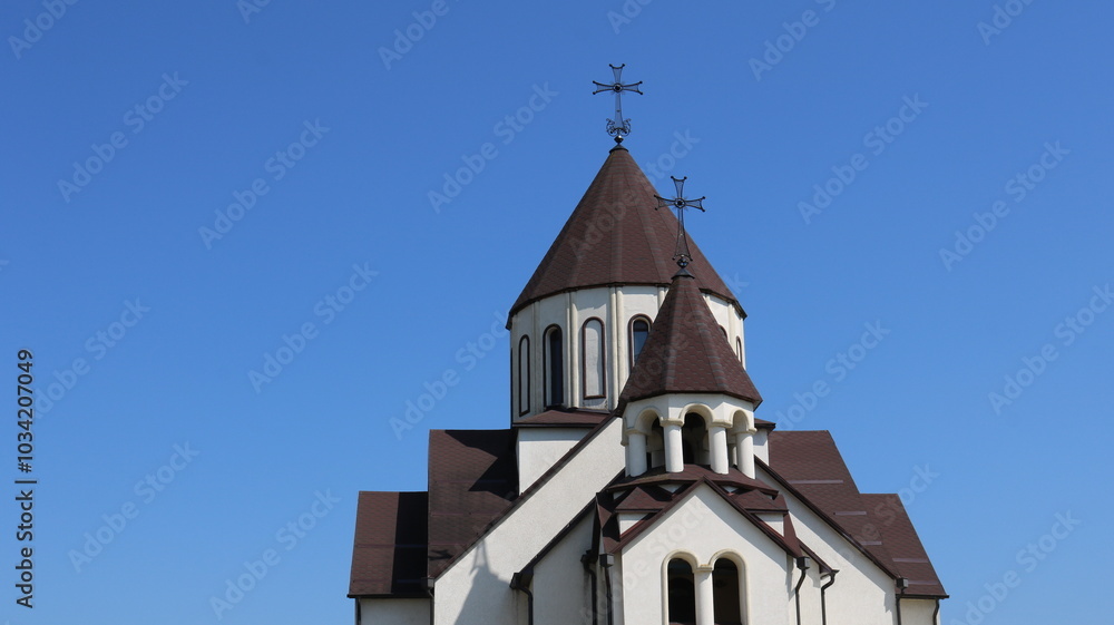 armenian apostolic church, upper part of light building with dark roof ...