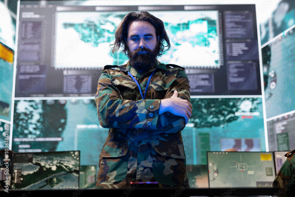 Army officer examining information on a hologram projection in control ...