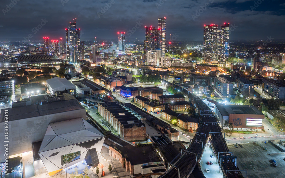 Manchester city centre at night, aerial view from the west. Iconic ...