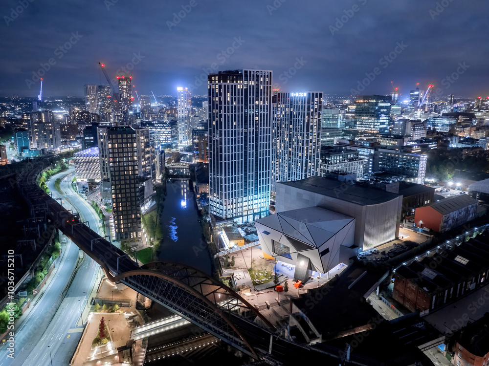 Manchester city centre at night, aerial view from the west. Iconic ...