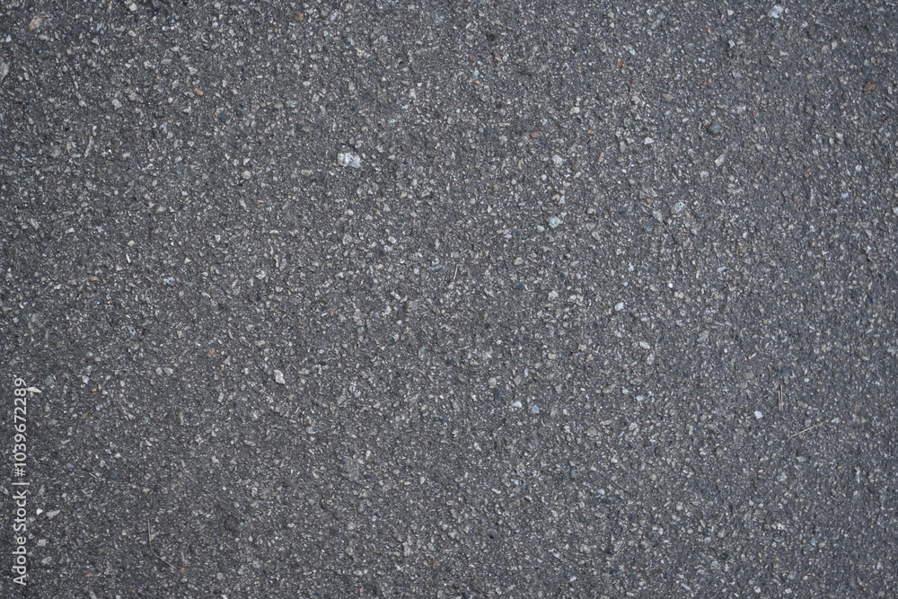 cracks on grey asphalt, repair of old road surface as background, wet ...