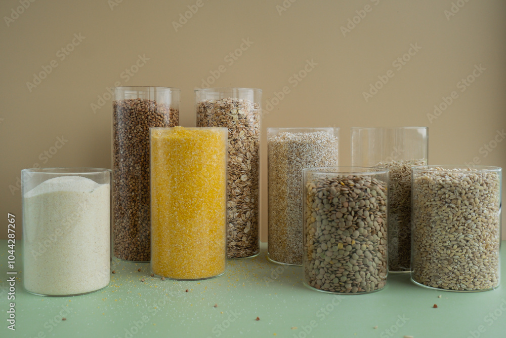 Refillable glass jar with raw grain porridge. Copy space Refill product ...
