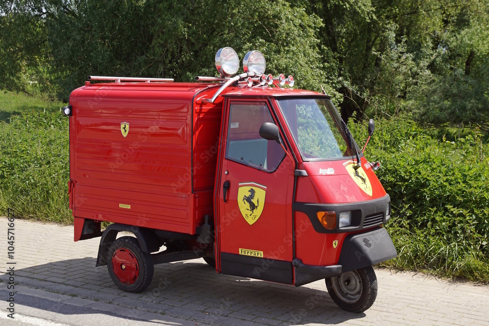Piaggio Ape 50 im ferrari design Stock Photo | Adobe Stock