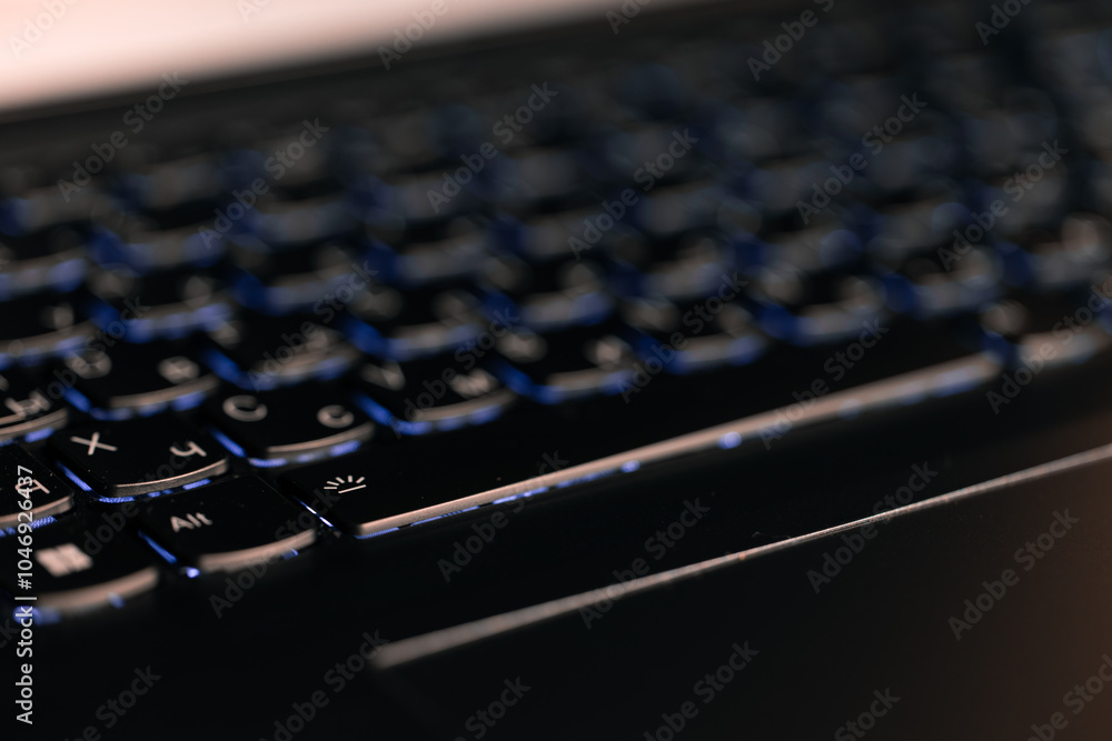 black keyboard laptop device illumination narrow focus photo with space ...