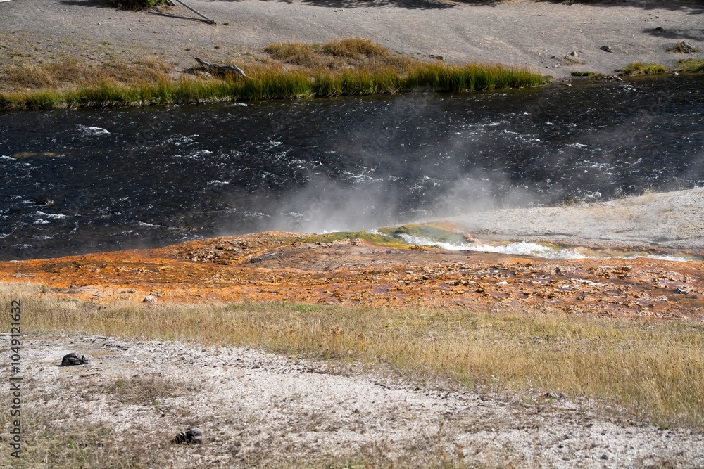 an active geyser spring with an intermittent discharge of water ejected ...