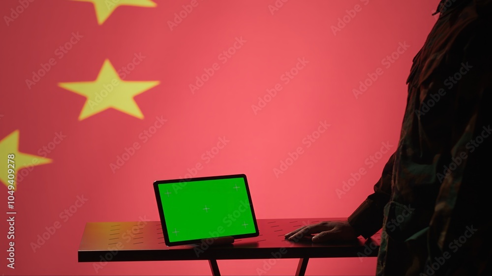 Chinese intelligence agency operator using green screen tablet to do ...