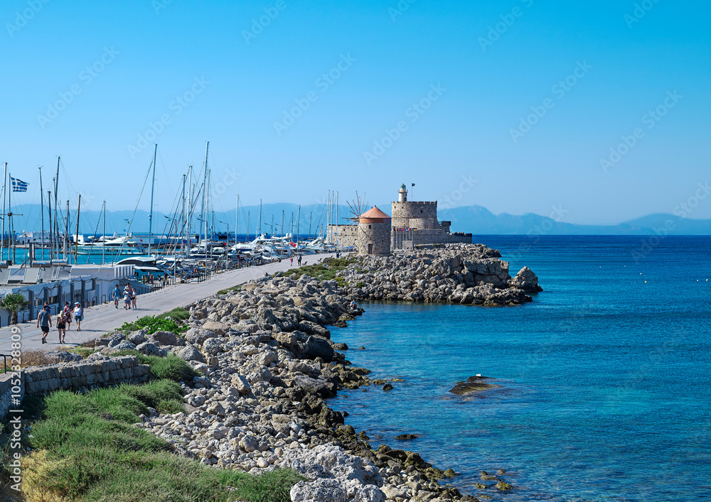 Greece, Rhodes, mole of Mandraki harbour with windmills, views of Saint ...