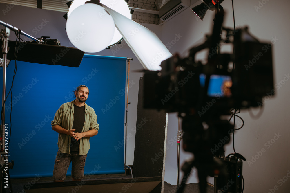 Professional male actor works in the frame on the set. Shooting with a ...