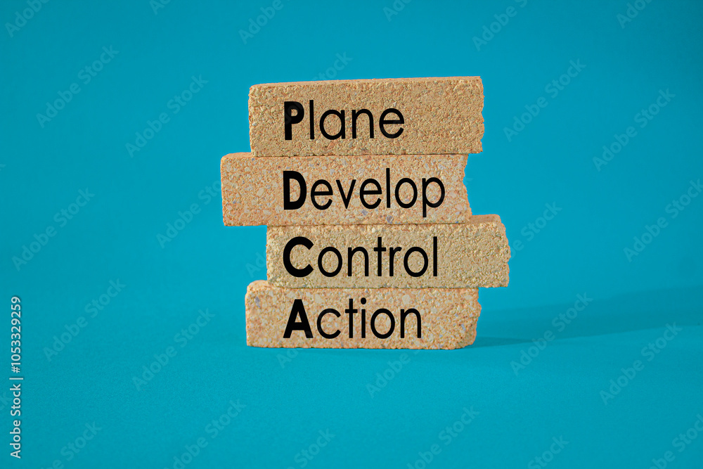 PDCA, plan develop control action symbol. Brick blocks with words PDCA ...