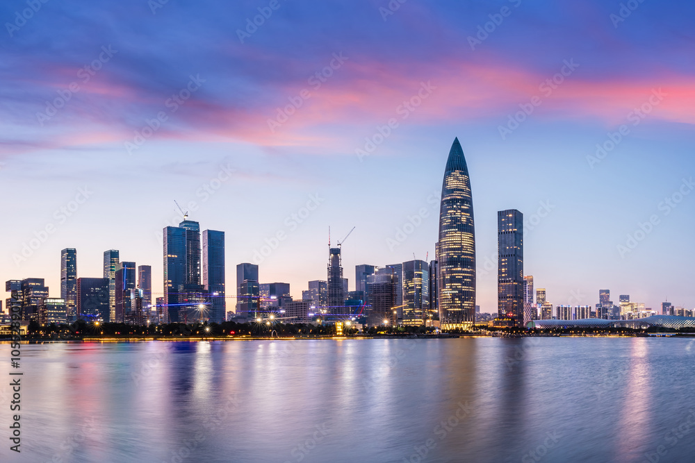 Shenzhen skyline and modern city buildings scenery by the lake at night ...