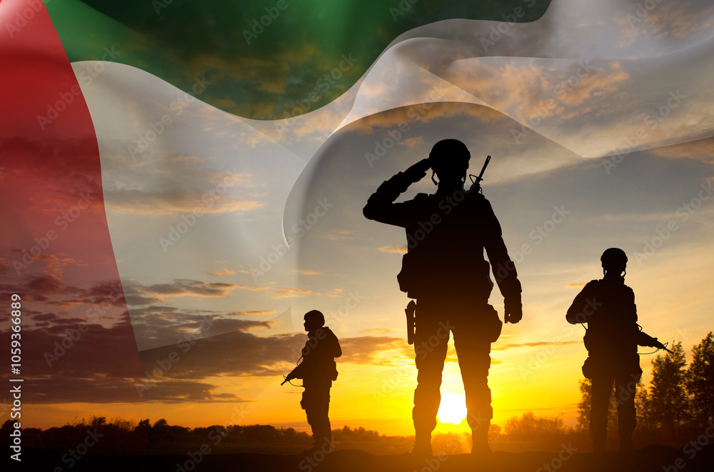 Silhouettes of a soldiers against the sunset and UAE flag. Armed forces ...