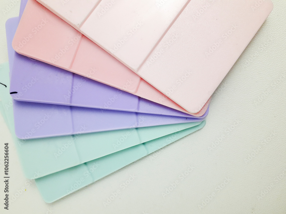 Various pastel colors of color chips on a white background, color ...