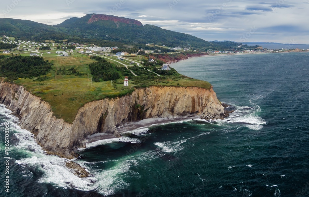 Phare du Cap Blanc ighthouse overlooking a cliff edge and wild ocean ...
