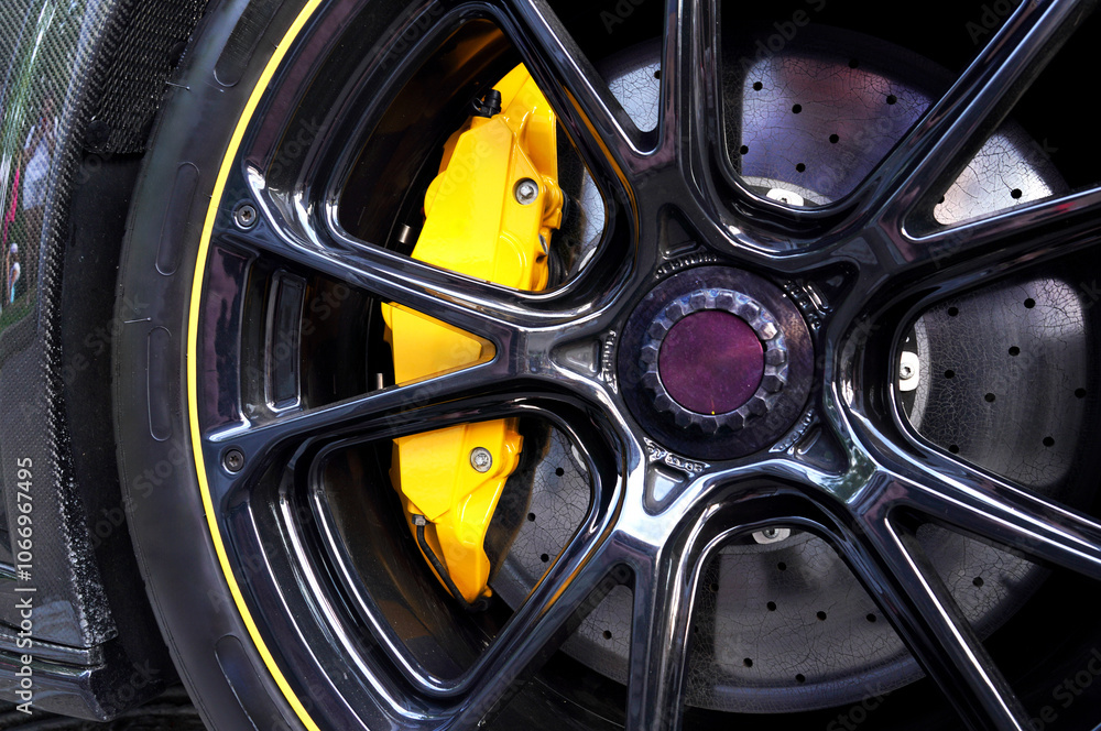 Alloy wheel with calipers and racing brakes of the sport car. Racing ...