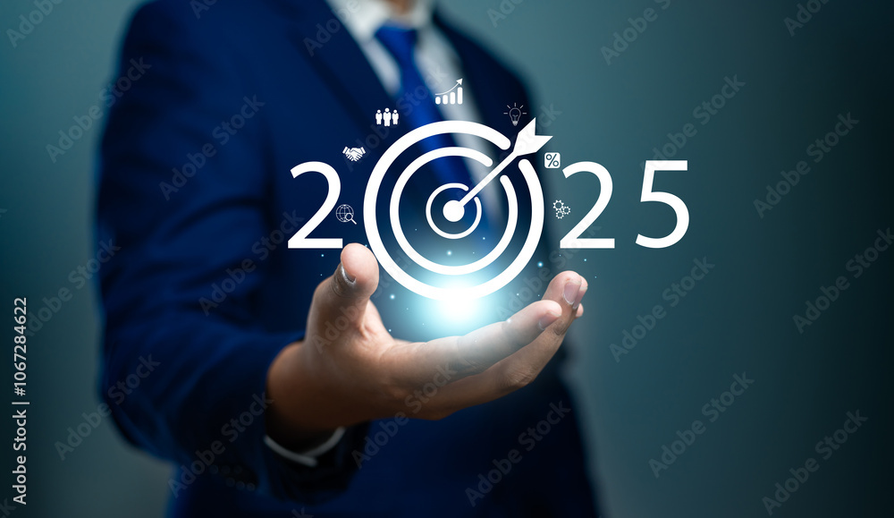 Set goals and strategy for 2025,Businessman holding icon of year 2025 ...
