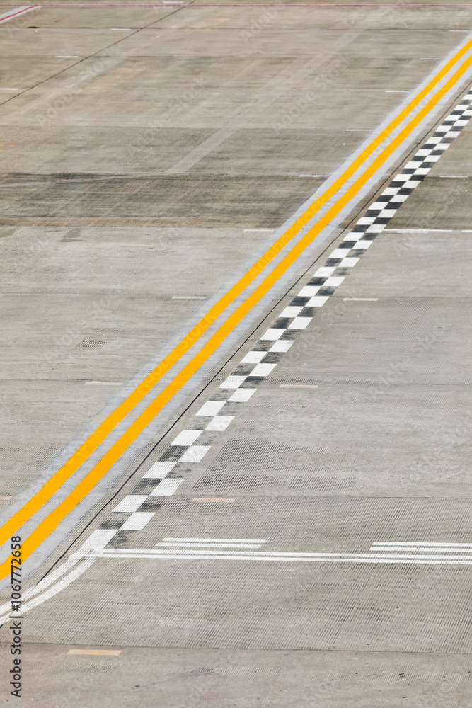 Yellow lines on airport runway, made of concrete, visual sign of the ...