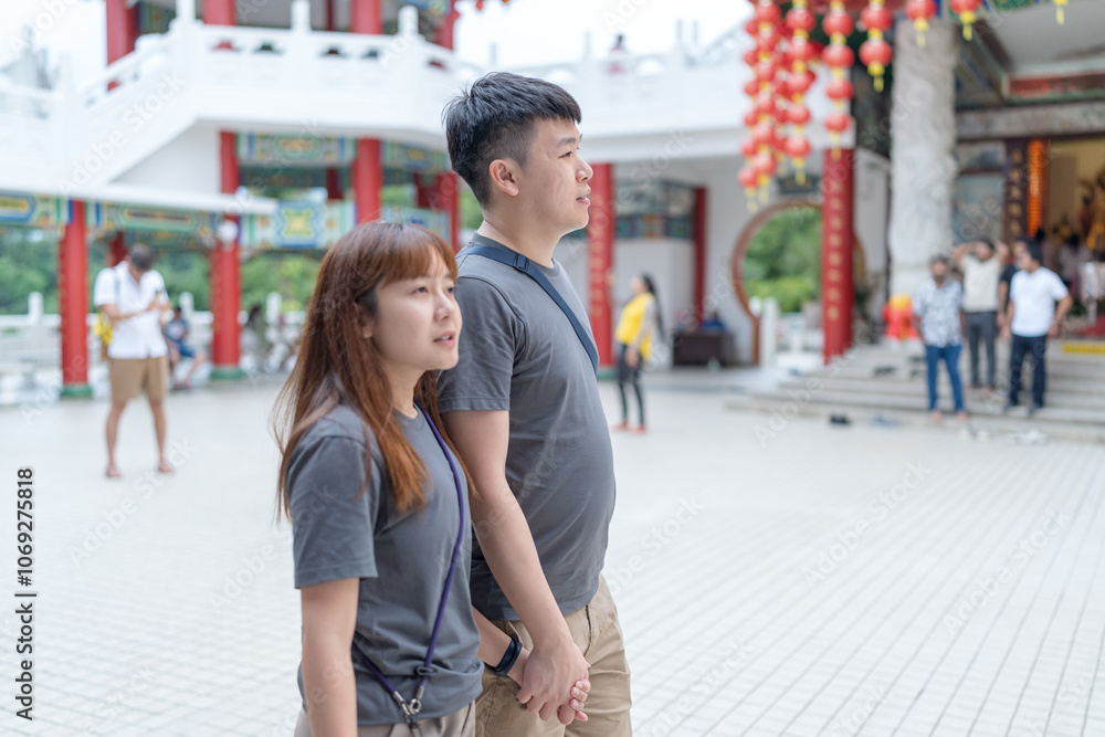 June 2024. A Chinese Malaysian couple in their 30s spends time at a ...