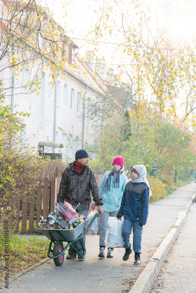 children carry a wheelbarrow with metal, poor children earn money ...