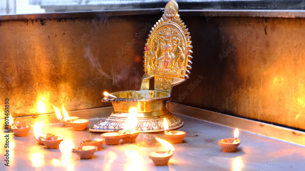 Lit candles adorn the temple altar, symbolizing an integral part of the ...