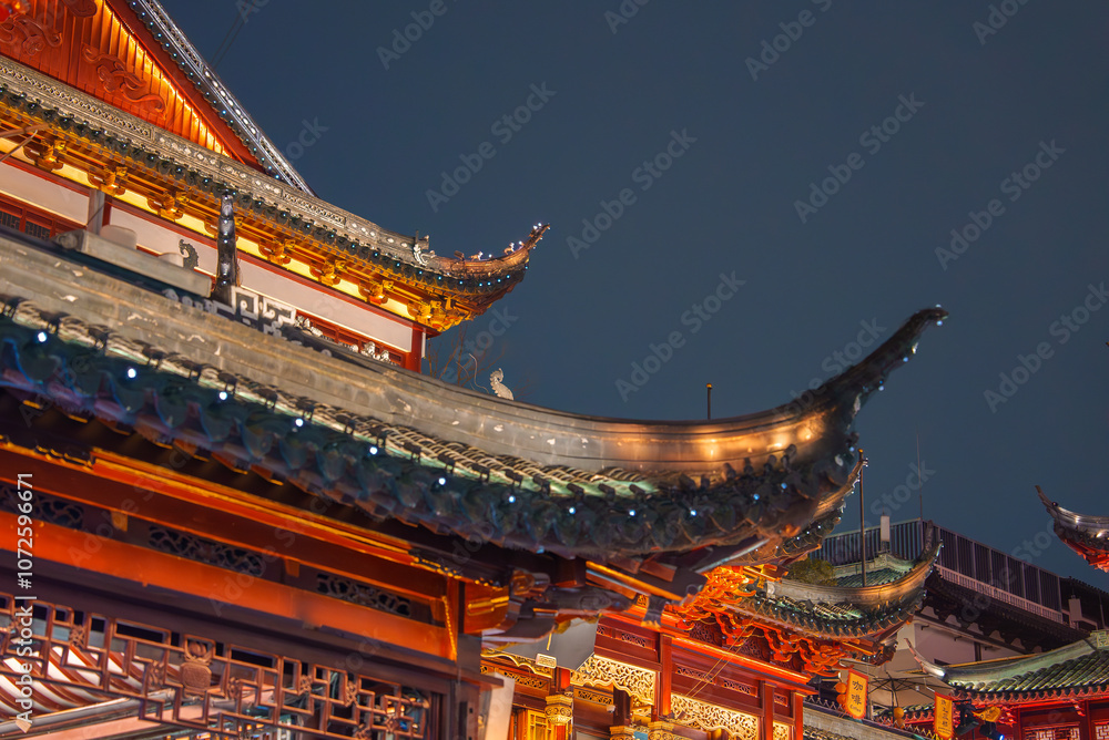 Traditional rooftops with upturned eaves and ornate details are ...