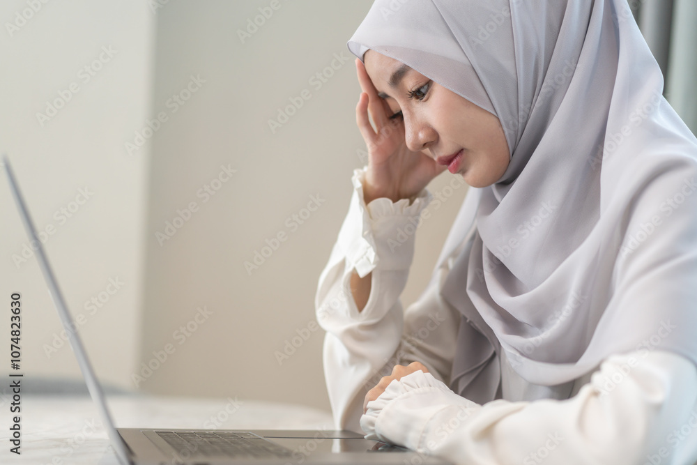 Young muslim woman in hijab experiencing stress and fatigue, headache ...