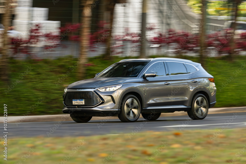 Silver BYD Song Pro in movement, Hybrid SUV in city street, High ...