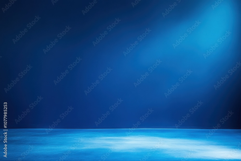 Blue studio background with spotlight. Stock Photo | Adobe Stock