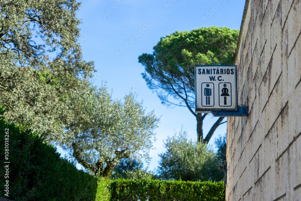Public restroom sign in a park, clear and visible for easy access, with ...