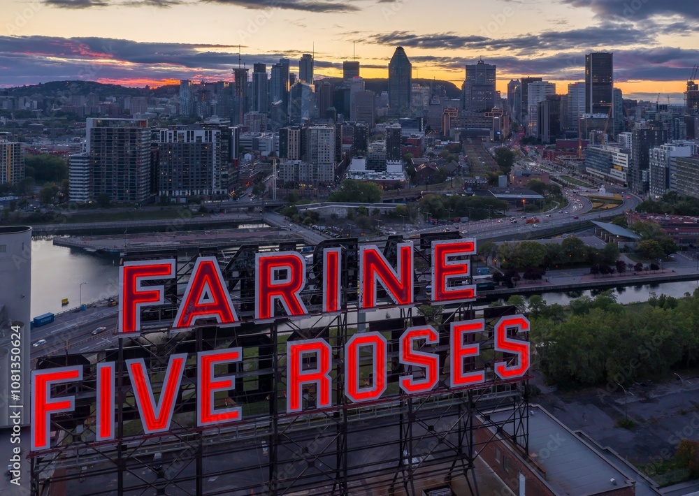 Farine Five Roses neon sign and downtown city skyline of Montreal at sunset, Montreal, Quebec ...