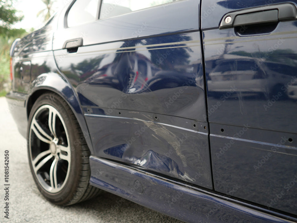 Vehicle Damage Assessment: This image shows a car with a noticeable ...