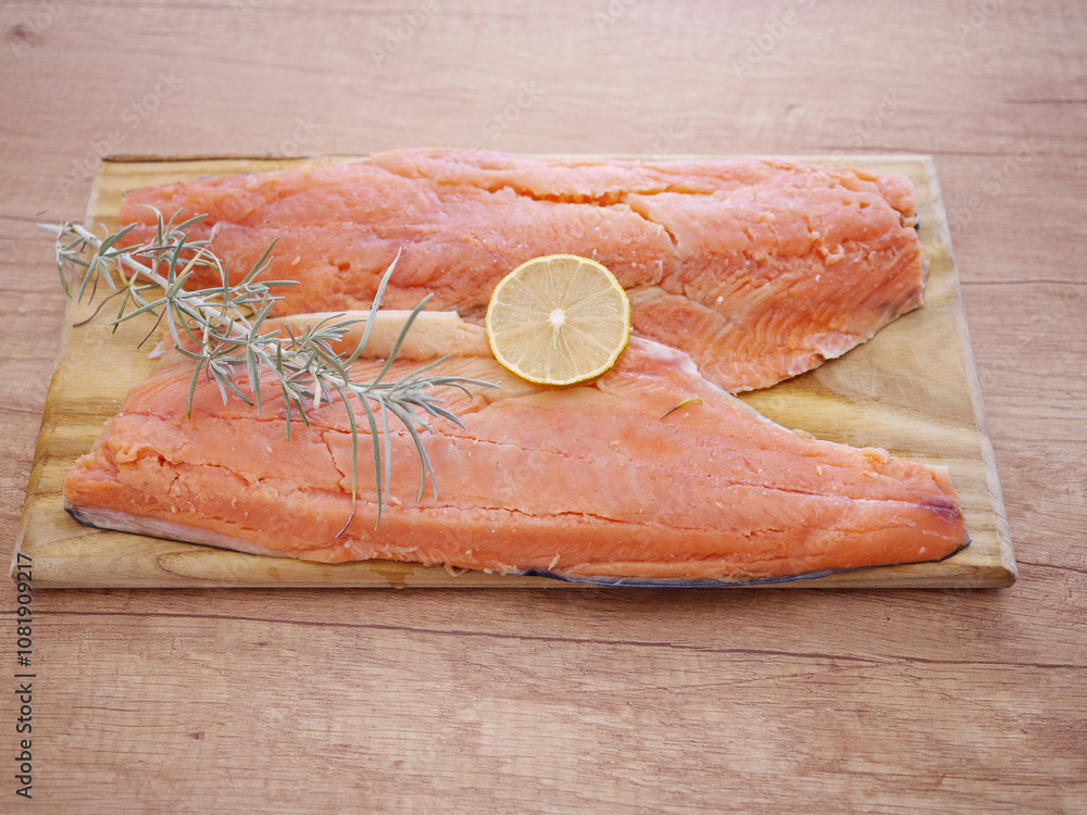 Salmon fillets ready for processing in the kitchen. Salmon is one of ...