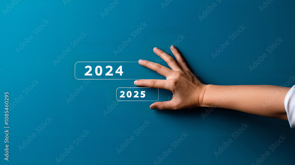 Welcoming 2025-Close-Up of Hand Reaching Out to New Year with a ...