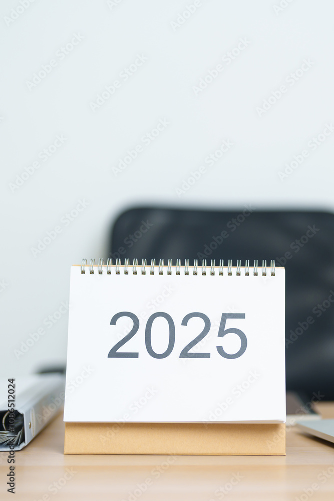 2025 Year Calendar on table with laptop computer during working and ...