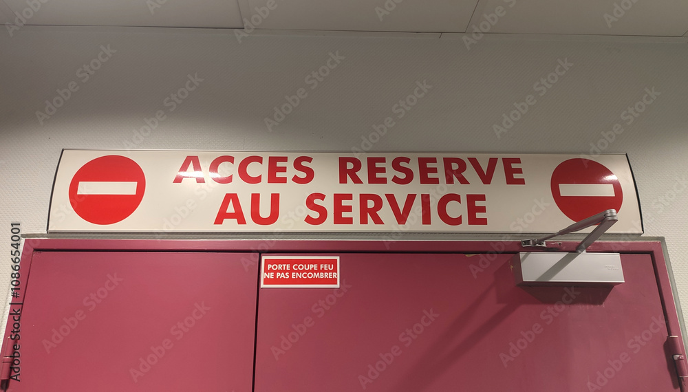 Sign indicating reserved access to the department, in French, placed ...