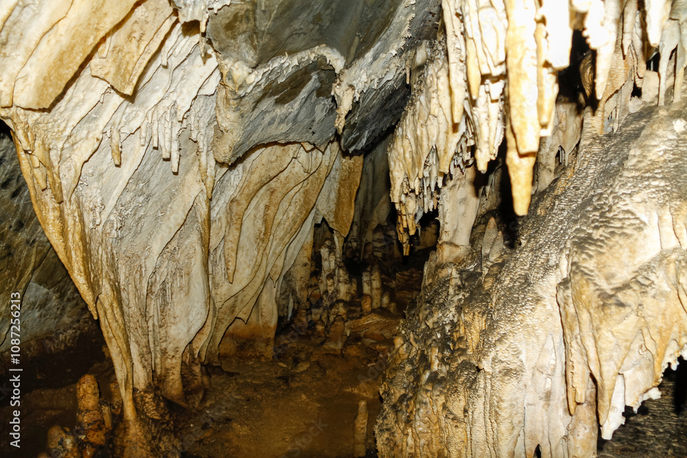 Stalactites and stalagmites in a cave, formed over thousands of years ...