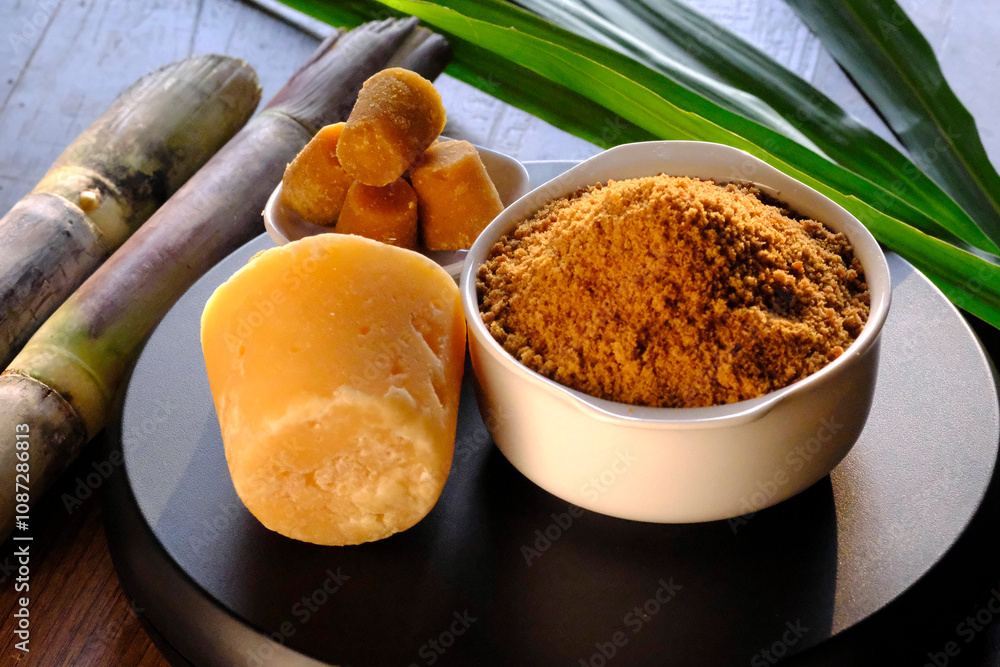 Jaggery powder with jaggery cubes. Jaggery is used as an ingredient in ...