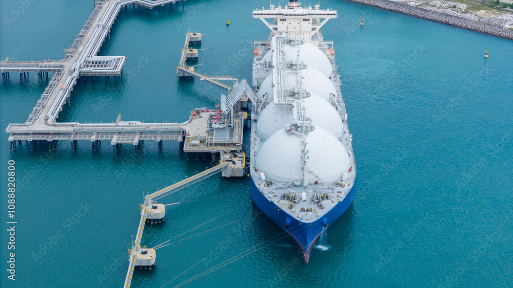 LNG (Liquified Natural Gas) tanker anchored in Gas terminal gas tanks ...