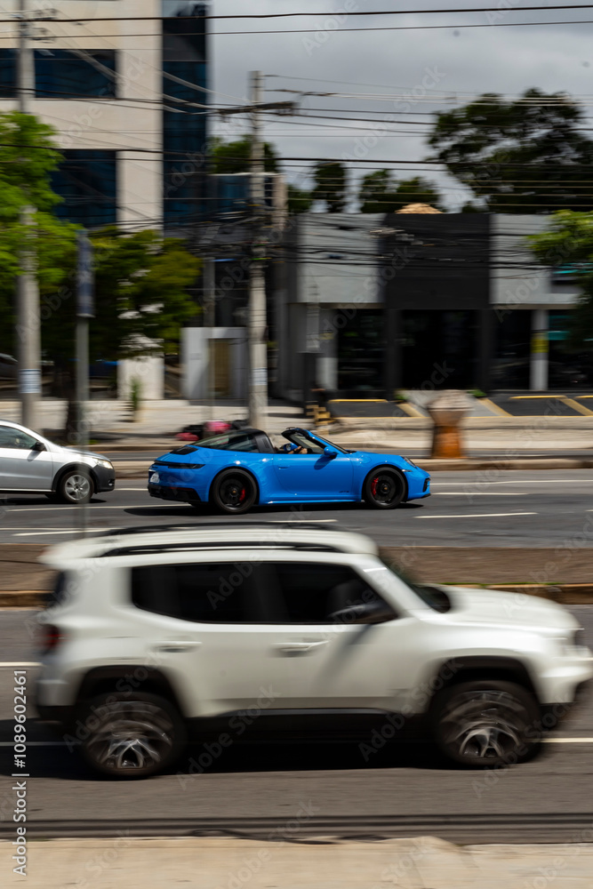 Blue Porsche 911 Targa in city street, Luxury Convertible Sportscar in ...
