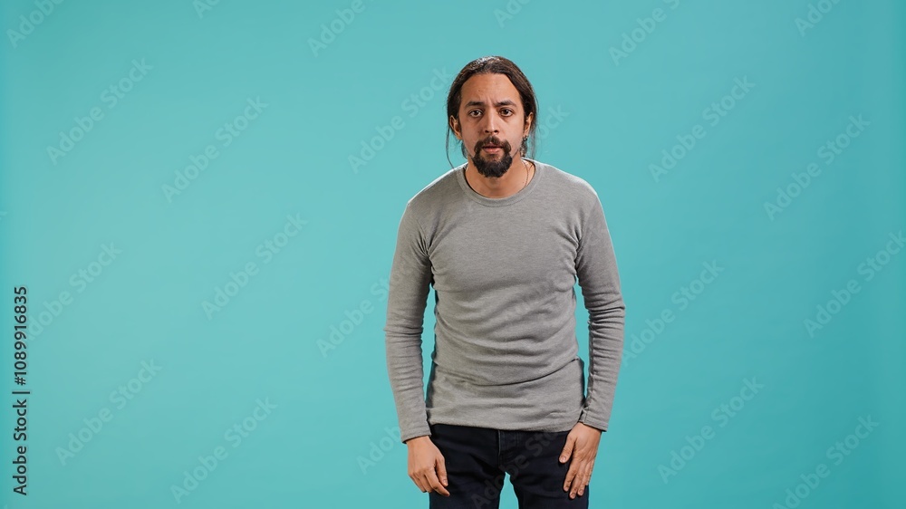 Portrait of frightened man covering his face with hands, standing ...